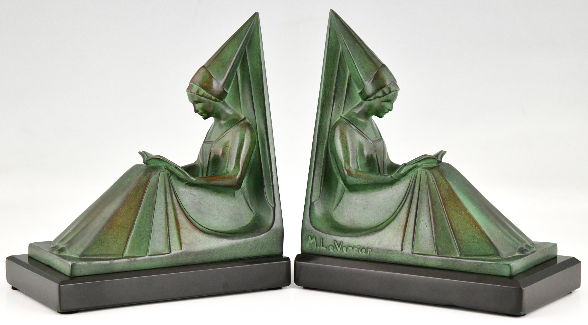 Art Deco bookends reading Medieval ladies. - Deconamic