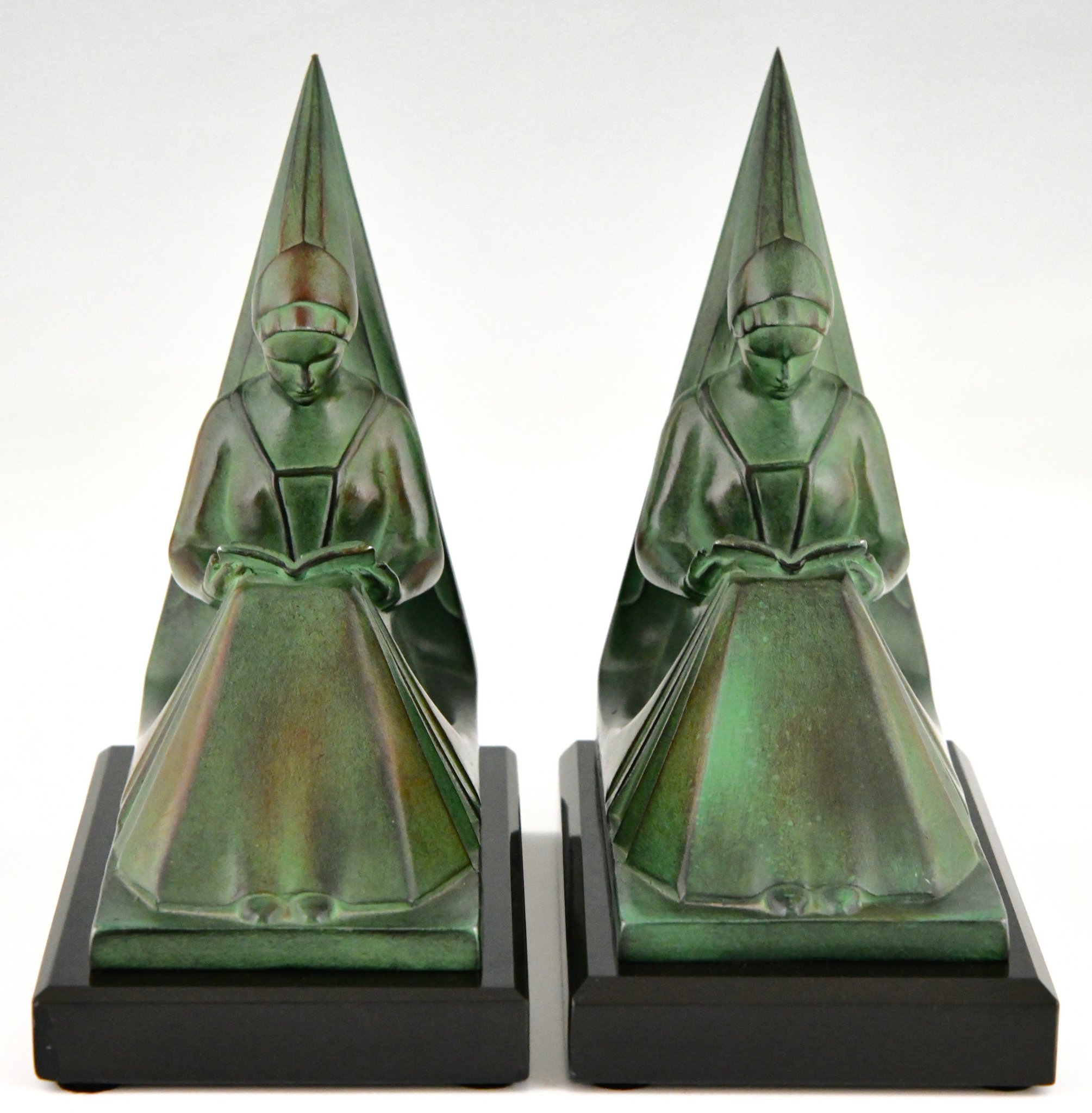 Art Deco bookends reading Medieval ladies. - Deconamic