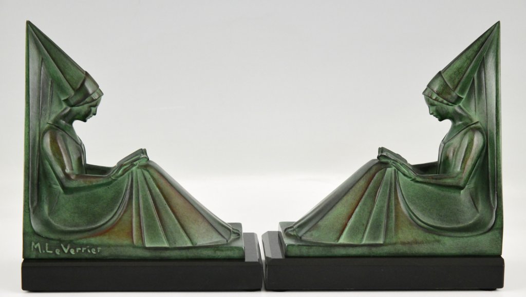 Art Deco bookends reading Medieval ladies. - Deconamic