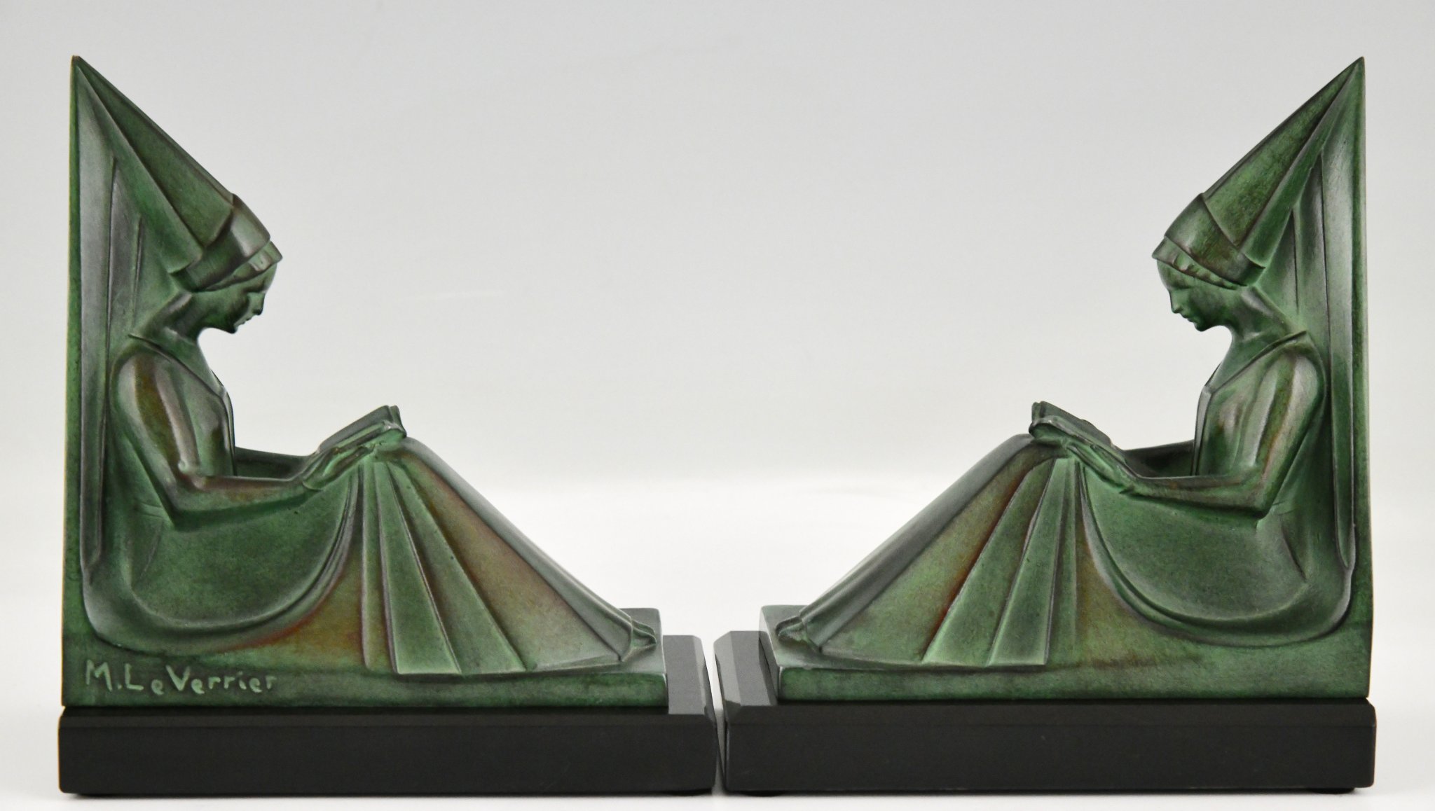 Art Deco bookends reading Medieval ladies. - Deconamic