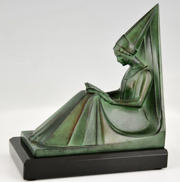 Art Deco bookends reading Medieval ladies. - Deconamic