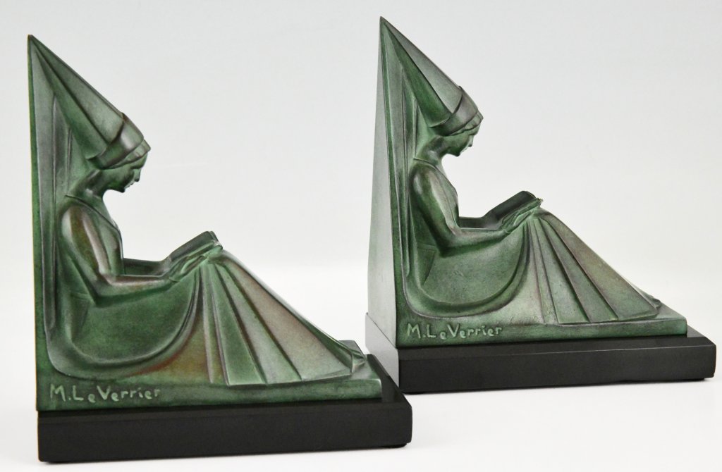 Art Deco bookends reading Medieval ladies. - Deconamic